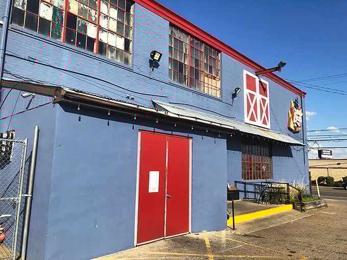 The unassuming blue exterior with barn-red accents is like a barbecue speakeasy—those in the know recognize this humble building houses smoky treasures within.