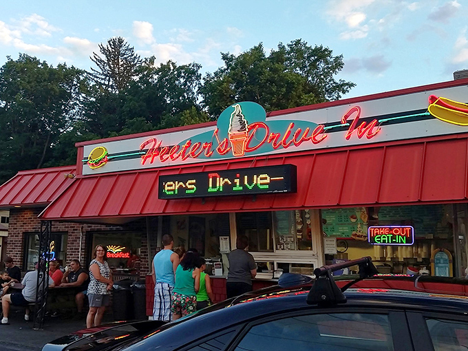 Twilight transforms this humble brick building into a beacon of comfort food promise. The red roof glows like a dinner bell calling hungry travelers home.