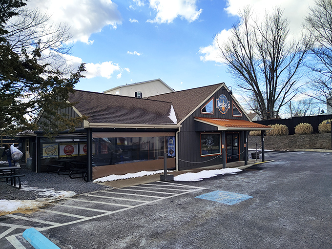 The unassuming blue exterior of Jesse's Barbecue hides culinary treasures within—like finding a diamond mine disguised as a garden shed.