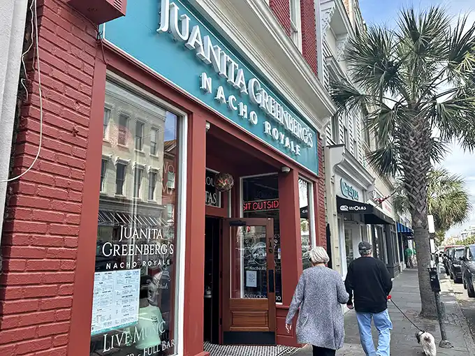The brick-red facade of Juanita Greenberg's stands like a delicious mirage on Charleston's historic streets, promising margarita magic and nacho nirvana within.