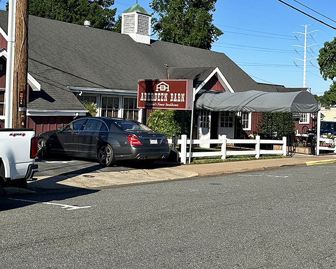 The red barn exterior isn't just charming architecture—it's a promise of carnivorous delights waiting inside. Like a beacon for beef lovers on Emmet Street.