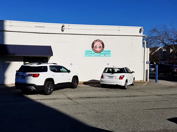 The unassuming exterior of Glazed Doughnuts in Hampton hides a world of pastry perfection. Sometimes the best treasures come in plain white packages.