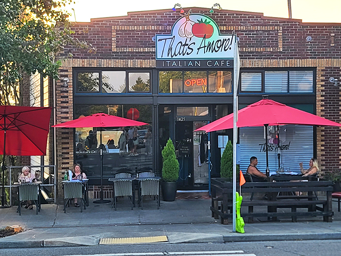 That neon tomato sign isn't just winking at you—it's inviting you into a brick-fronted paradise where pasta dreams come true.