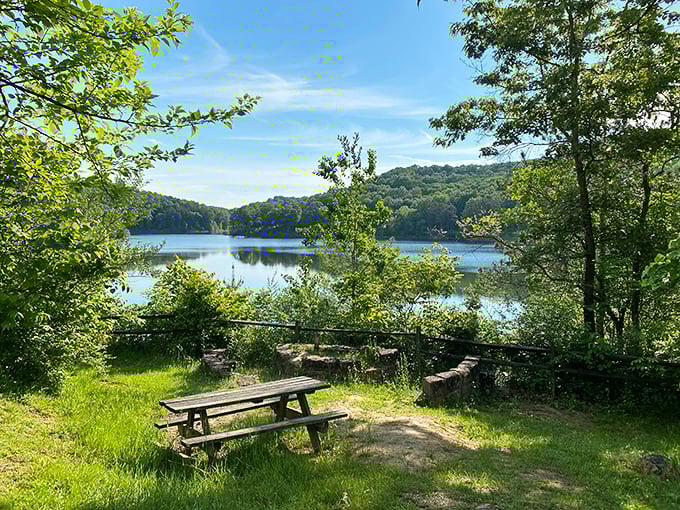 The glassy waters of Lake Hope mirror the surrounding hills like nature's selfie. A wooden dock invites you to pause and contemplate life's simple pleasures.