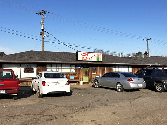 No architectural awards needed here—just a humble wooden exterior that promises more flavor per square foot than any fancy establishment in town.
