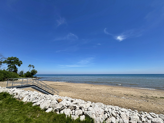Lake Michigan stretches to the horizon like nature's infinity pool. The stone stairway practically begs you to kick off your shoes and feel that sand between your toes.