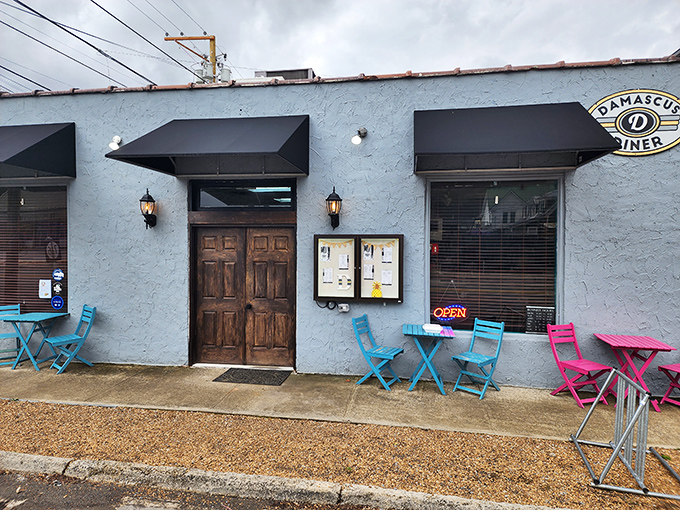 The unassuming blue exterior of Damascus Diner stands like a quiet promise – extraordinary flavors await inside this Trail Town USA landmark.