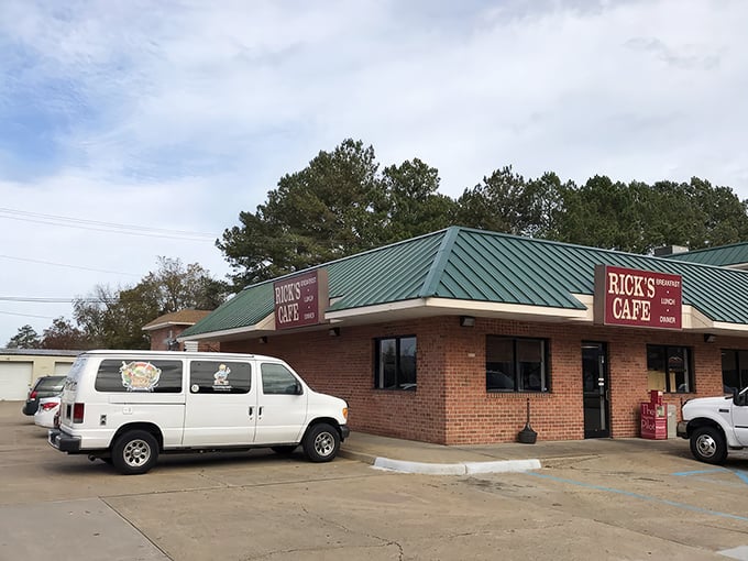 Rick's Cafe stands like a beacon of breakfast hope with its iconic green roof and red signage – an unassuming treasure waiting to be discovered.