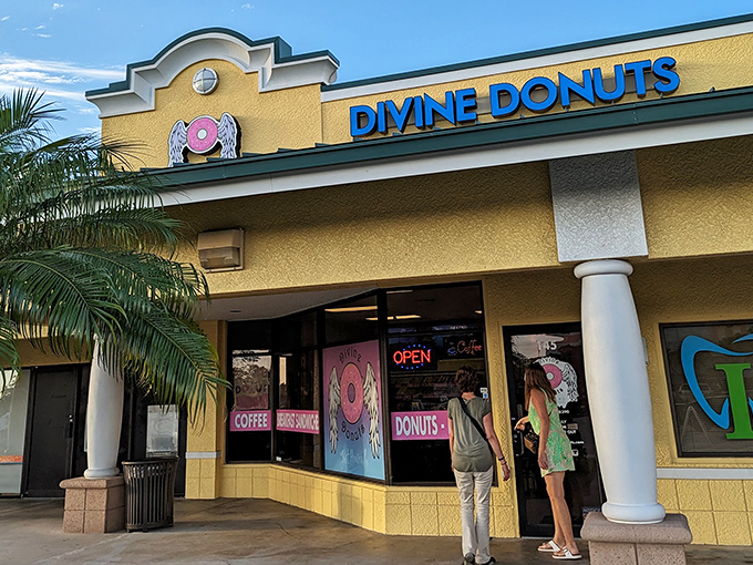 The cheerful yellow facade of Divine Donuts stands out like a sugary beacon in Fort Myers, promising sweet salvation for donut enthusiasts.