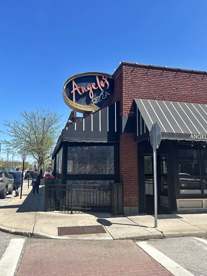 The unassuming brick façade of Angelo's Pizza hides culinary treasures within. Like a superhero's secret identity, it's modest on the outside, magnificent on the inside.