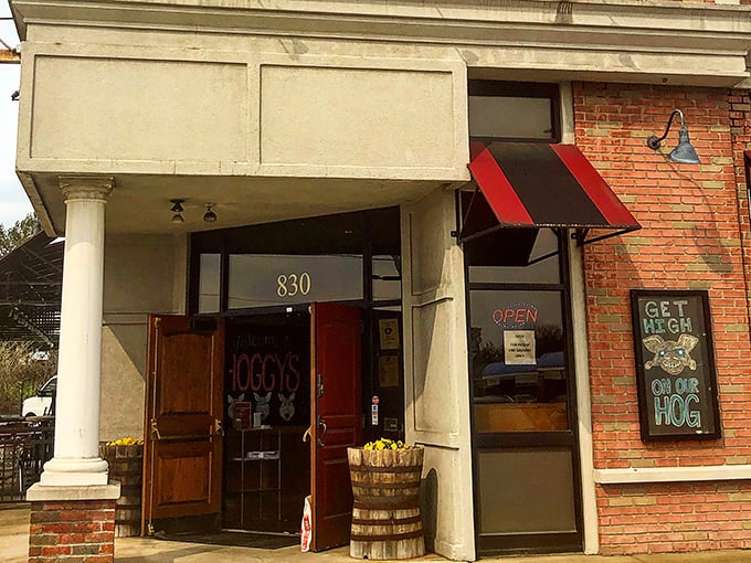 The red door at Hoggy's BBQ isn't just an entrance—it's a portal to smoke-kissed nirvana that Columbus locals have treasured for years.