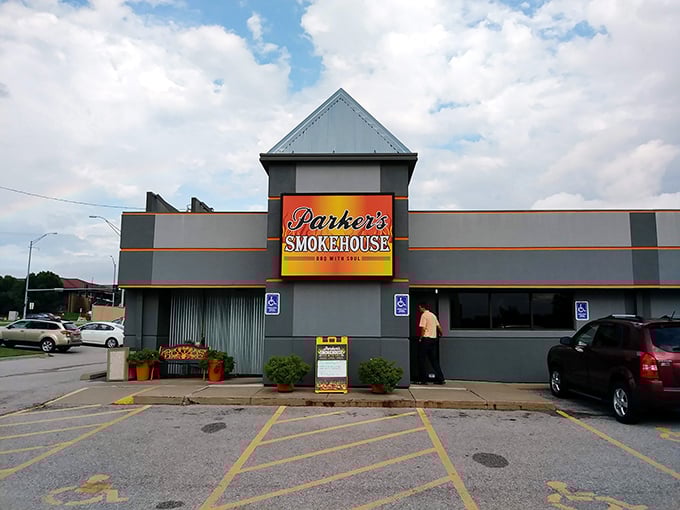 The blue neon sign proclaiming "BBQ WITH SOUL" isn't just marketing—it's a mission statement that Parker's Smokehouse delivers on with every smoky bite. 