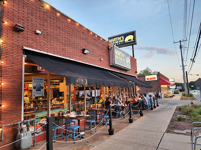 The red brick exterior of Martin's Bar-B-Que Joint beckons hungry pilgrims with its no-nonsense façade and the promise of smoky delights within.