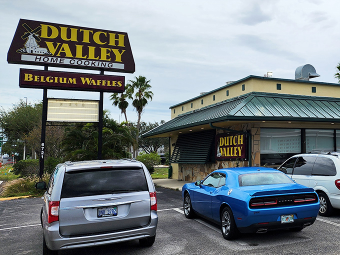 The unassuming exterior of Dutch Valley Restaurant promises "HOME COOKING" and "BELGIUM WAFFLES" – a modest declaration that understates the breakfast magic waiting inside.