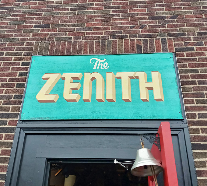 The turquoise sign beckons like a portal to another dimension—one where vegetarian food and vintage treasures coexist in perfect harmony.