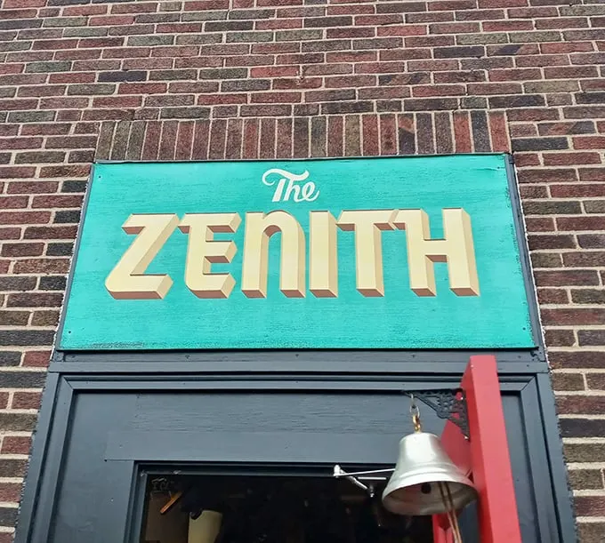 The turquoise sign beckons like a portal to another dimension—one where vegetarian food and vintage treasures coexist in perfect harmony.