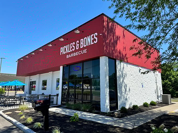 The bright red exterior of Pickles & Bones stands like a beacon of barbecue hope against the Ohio sky. Meat salvation awaits inside.