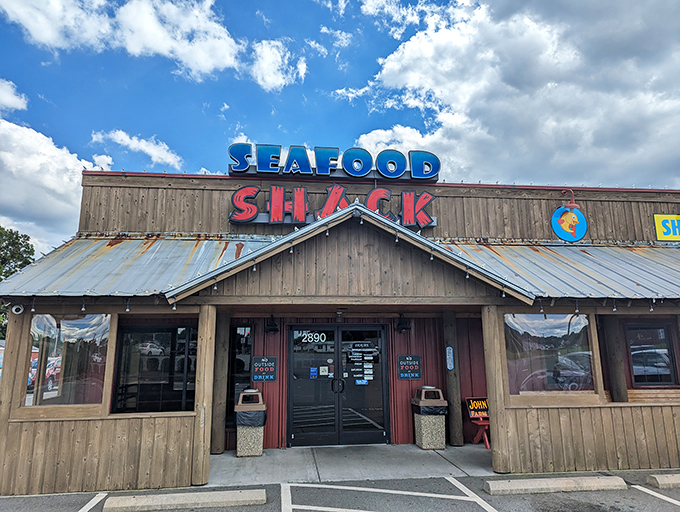 The wooden exterior of Walkertown Seafood Shack stands like a beacon of fried goodness, promising seafood treasures within those rustic walls.