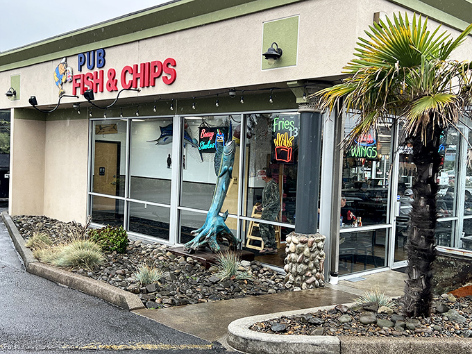 The unassuming exterior of Pub Fish & Chips hides culinary treasures within. That blue marlin sculpture? Consider it your first clue to seafood excellence.