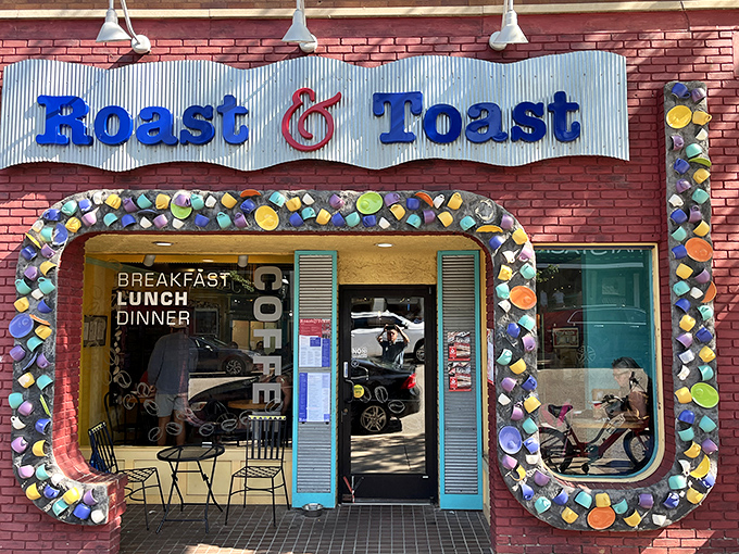 The colorful coffee mug entrance to Roast & Toast isn't just decorative—it's a caffeinated welcome committee promising good things await inside.