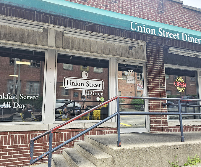 The unassuming brick exterior with its signature green awning promises comfort food magic within. Athens' hidden breakfast gem awaits.