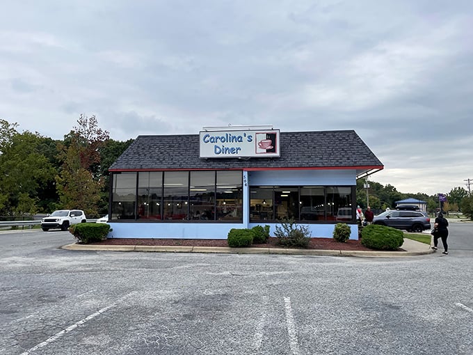 The blue-trimmed exterior of Carolina's Diner stands like a beacon of breakfast hope against the North Carolina sky. Comfort food paradise awaits!