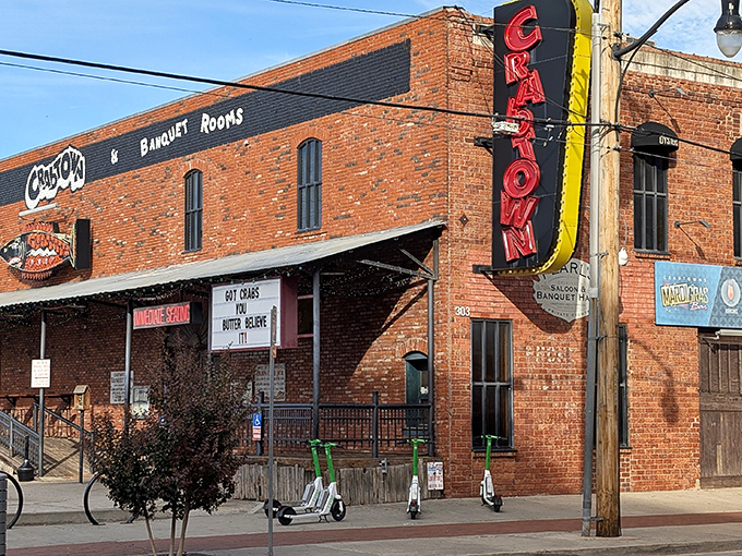 The brick facade and vintage neon sign of Pearl's Crabtown stand as a beacon for seafood lovers in landlocked Oklahoma City. Maritime dreams in Bricktown!