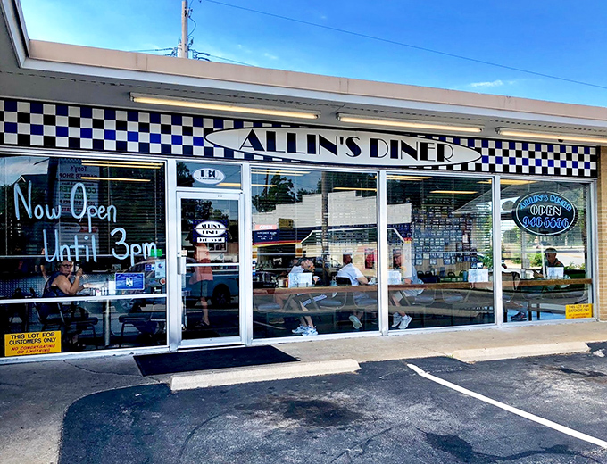 The classic black-and-white checkered awning of Allin's Diner isn't just decoration—it's a beacon calling hungry souls to pancake paradise.
