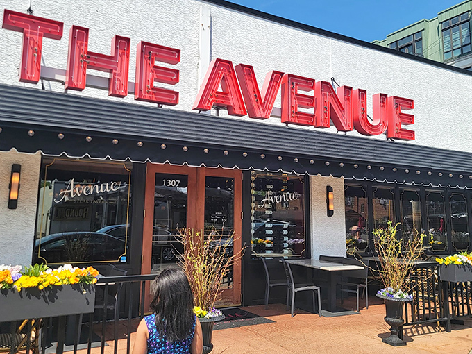 The Avenue's bold red signage against crisp white façade stands as a beacon for steak lovers. Columbus's answer to carnivorous prayers.