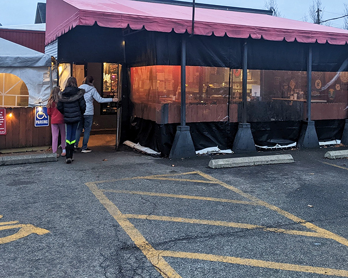 The unassuming red brick exterior of DK Diner hides culinary treasures within. Those picnic tables have witnessed countless breakfast epiphanies.
