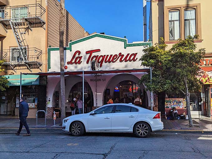 The iconic white facade with its distinctive red script beckons hungry pilgrims like a taco temple. Those arches aren't just decorative—they're gateways to burrito bliss.