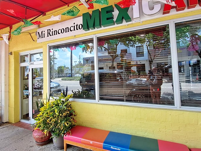 The sunshine-yellow exterior with its festive red awning isn't just a restaurant—it's a landmark for burrito pilgrims throughout Florida.