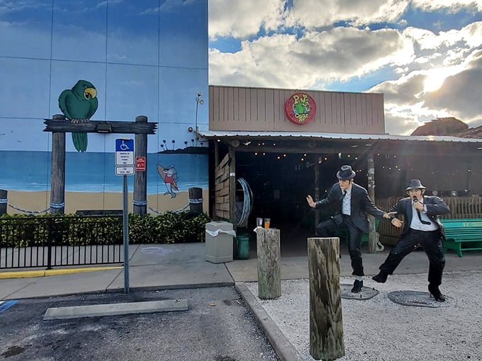 The thatched tiki roof and vibrant green exterior of P.J.'s stands out like a tropical oasis, promising seafood treasures within this Indian Rocks Beach landmark.