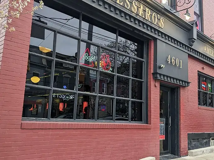 The brick facade and neon beer signs of Tessaro's aren't trying to impress you—they're too busy guarding Pittsburgh's best-kept burger secret.