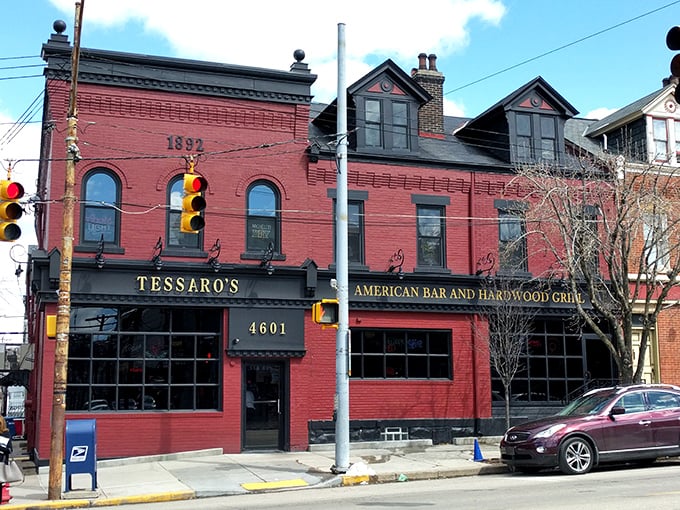 The brick-red facade of Tessaro's stands like a beacon of burger hope on Liberty Avenue, promising carnivorous delights within those historic walls.
