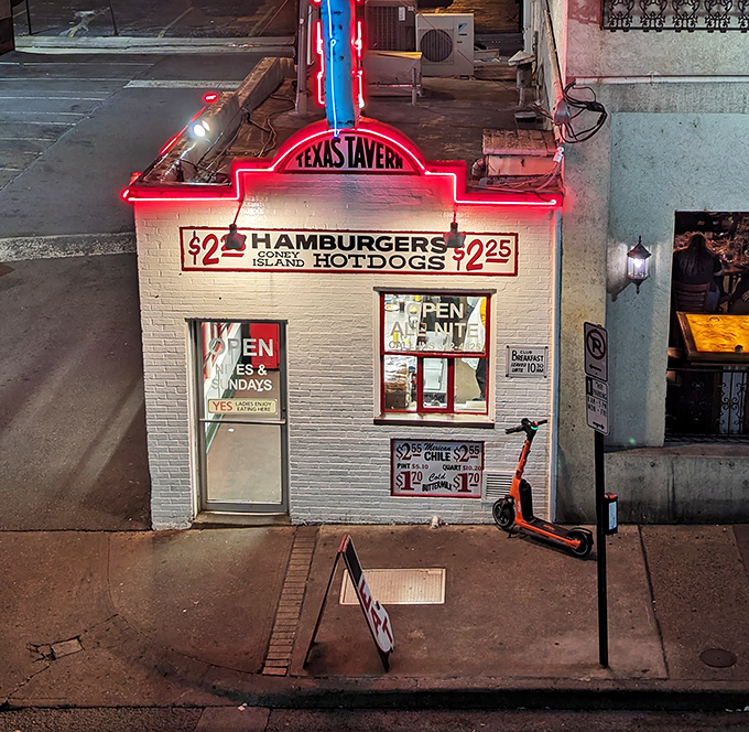 The white brick façade of Texas Tavern stands like a time capsule in downtown Roanoke, its vintage signage promising simple pleasures that never go out of style.