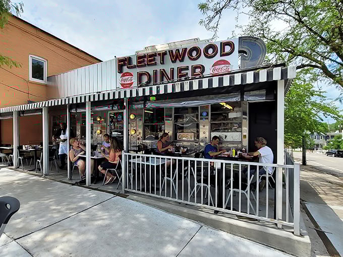 The iconic silver exterior of Fleetwood Diner gleams in the Michigan sunshine, a time capsule of Americana where hungry souls find refuge 24/7.