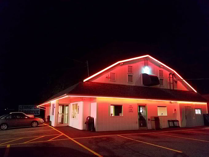 The neon-trimmed roofline glows like a barbecue beacon in the night, guiding hungry pilgrims to this temple of smoke and flavor.
