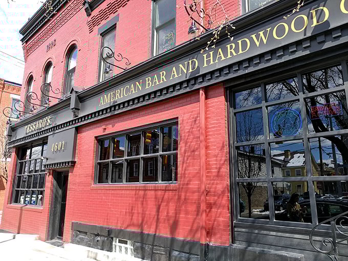 The brick-red facade of Tessaro's stands like a beacon of burger hope on Liberty Avenue, promising carnivorous delights within those historic walls.