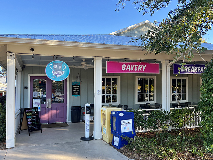 The unassuming exterior of BuzzCatz with its cheerful purple door promises culinary treasures within. Like finding a diamond in a beach town—this place delivers.