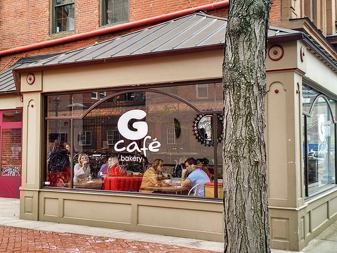 The storefront beckons like an old friend, with its tan facade and large windows offering glimpses of culinary happiness within. New Haven's brick sidewalks lead right to deliciousness.