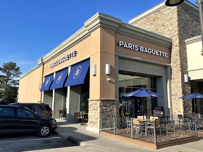 The Edison outpost of Paris Baguette beckons with its distinctive blue awnings and stone facade – like a modern French café that somehow landed in a New Jersey strip mall.