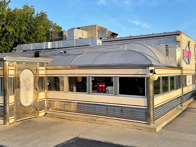 The classic Americana exterior of Nancy's beckons with its roller-skating waitress mural and vintage signage—a time capsule of diner culture waiting to be explored.
