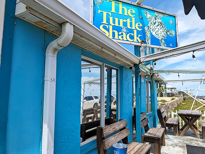 The vibrant turquoise exterior of Turtle Shack Cafe stands out like a beacon for hungry travelers. Florida coastal dining at its unpretentious best.