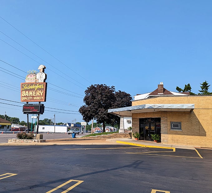 That vintage sign with the chef holding a birthday cake isn't just advertising – it's a St. Louis landmark promising sweet salvation ahead.