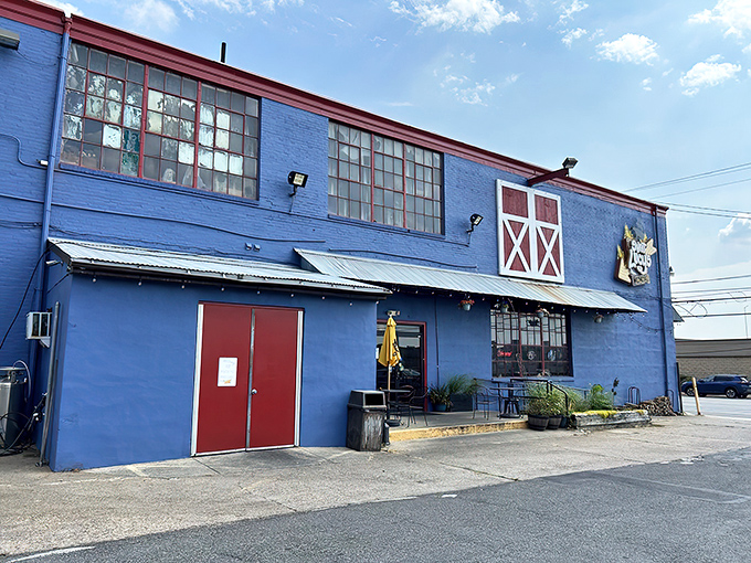 The unassuming blue exterior with barn-red accents is like a barbecue speakeasy—those in the know recognize this humble building houses smoky treasures within.
