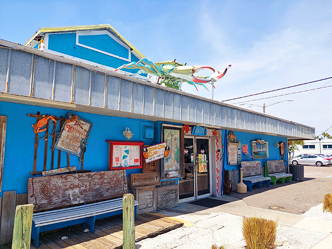 The iconic turquoise exterior of Crabby Bill's stands out against the Florida sky like a beacon for hungry beachgoers seeking seafood salvation.