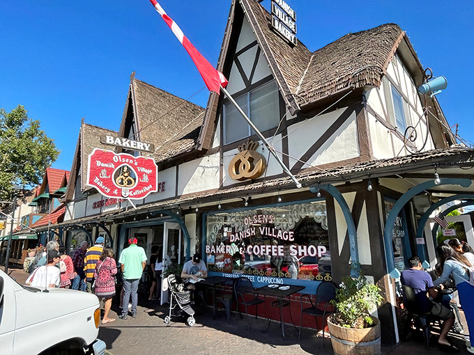 The fairytale facade of Olsen's Danish Village Bakery welcomes visitors with its half-timbered charm and thatched roof. Denmark called—it wants its architecture back!