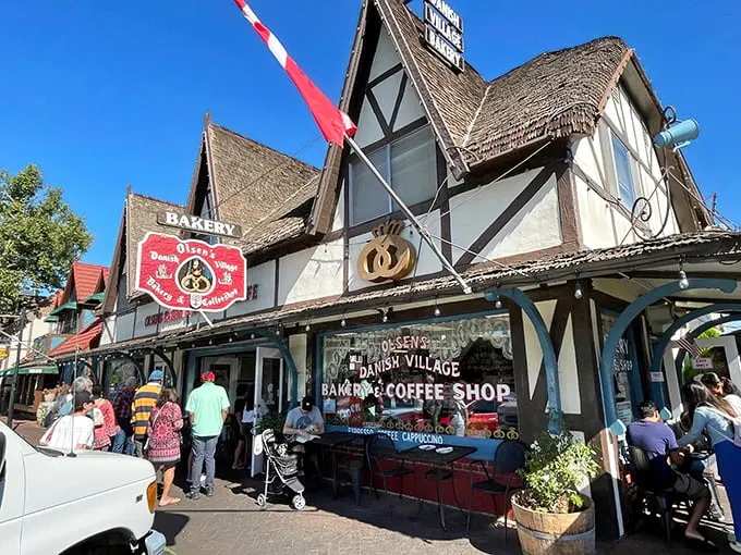 The fairytale facade of Olsen's Danish Village Bakery welcomes visitors with its half-timbered charm and thatched roof. Denmark called—it wants its architecture back!