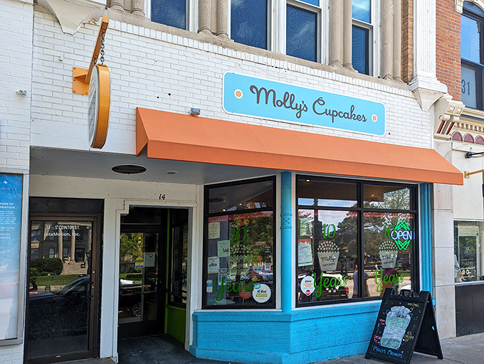 The blue and orange storefront of Molly's Cupcakes stands out on Iowa City's Washington Street like a dessert oasis in a sea of brick buildings.